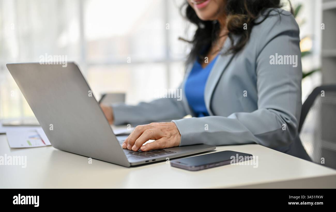 Close-up image of a professional Asian senior businesswoman using her ...