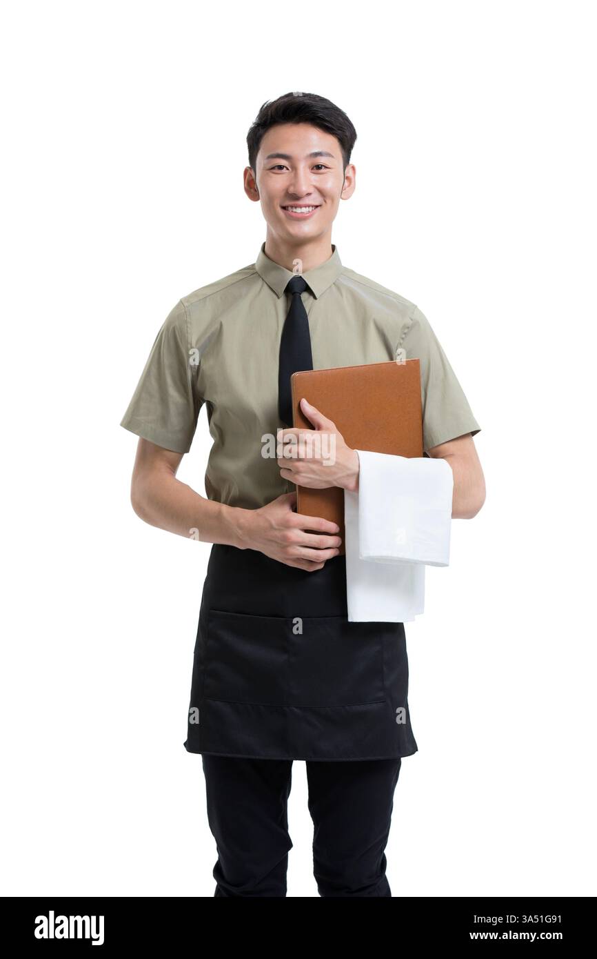 Smiling Chinese male waiter holding menu while standing with towel on ...