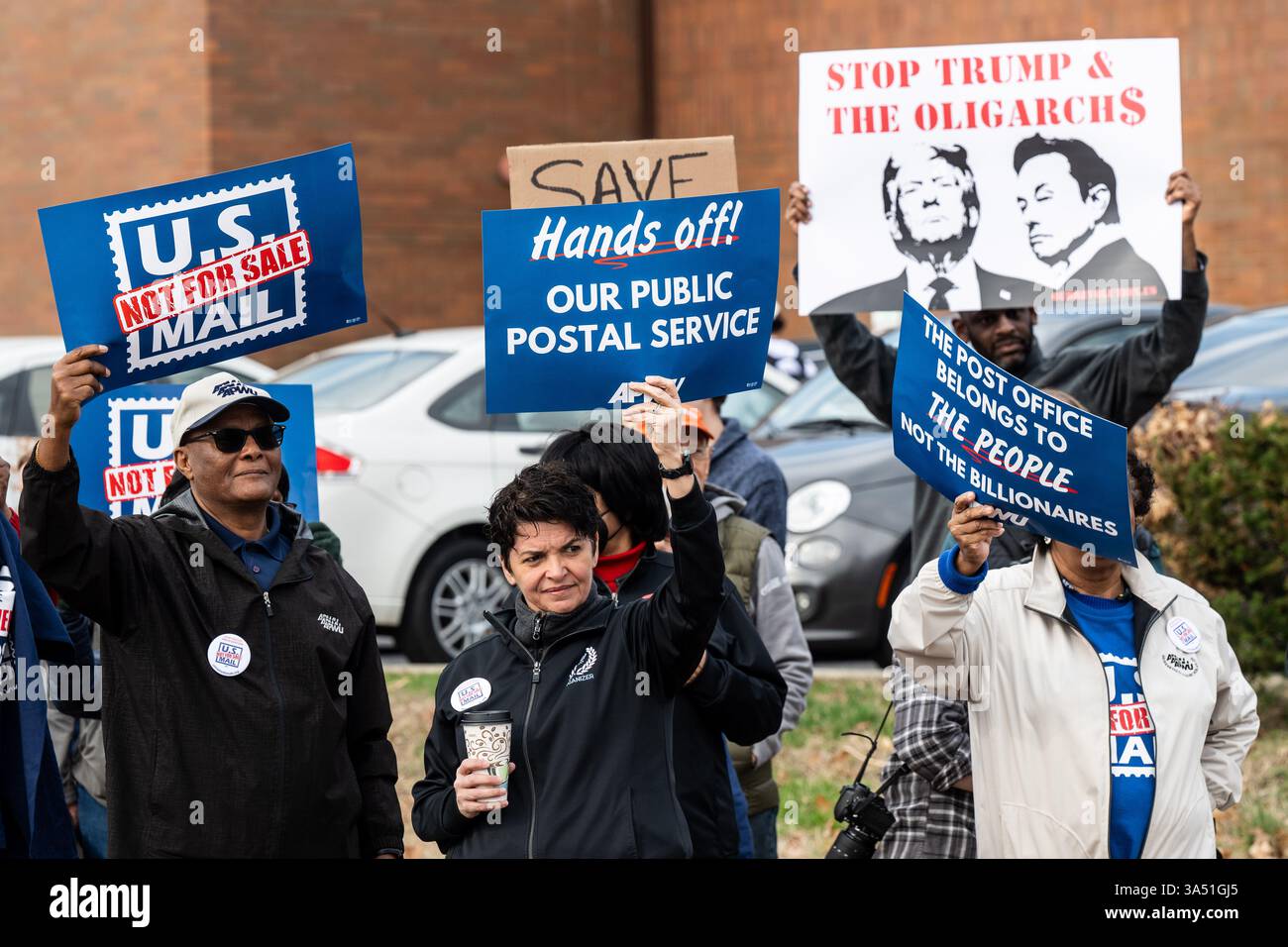 Washington, United States. 20th Mar, 2025. People holding signs saying ...