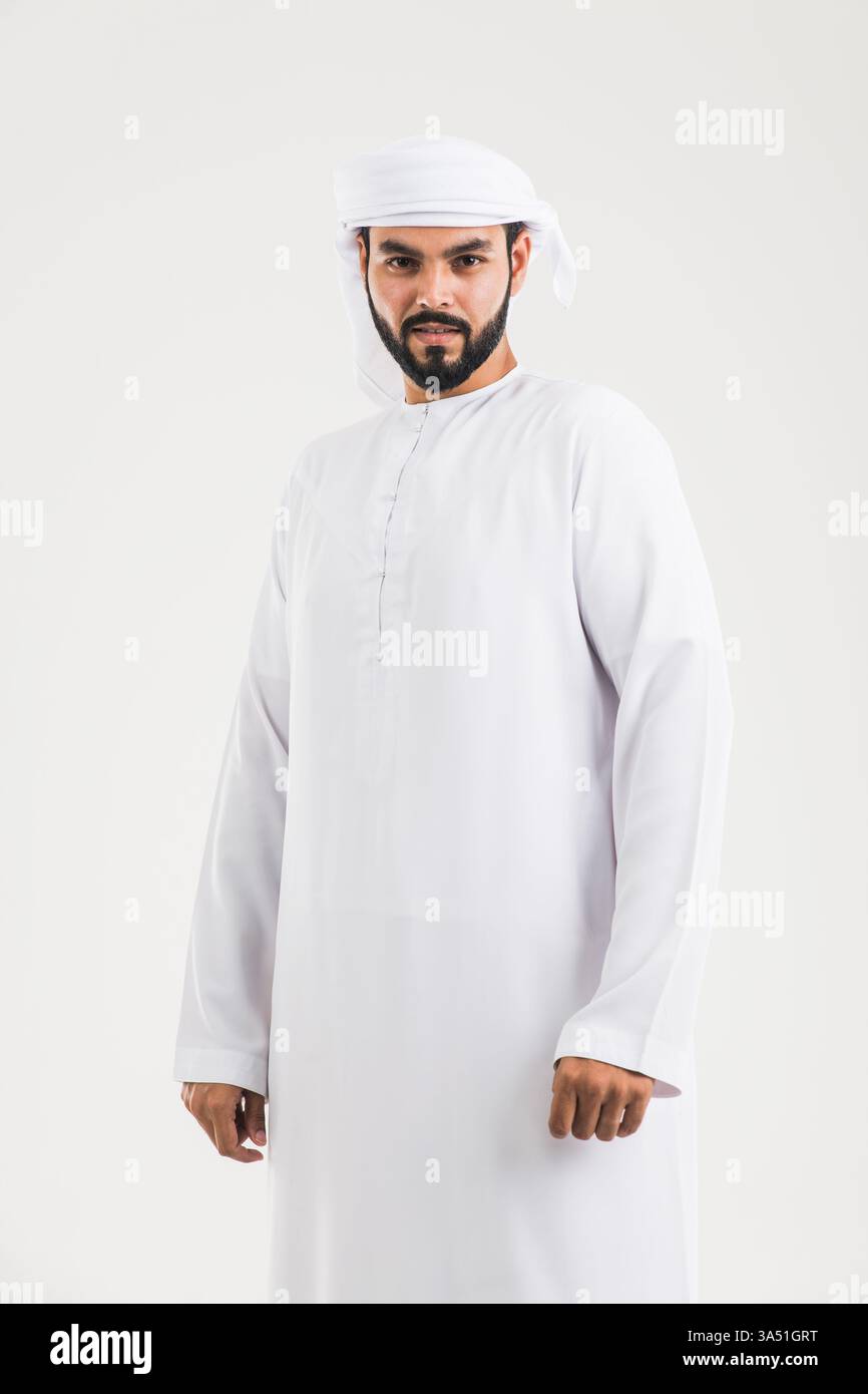 Handsome man with traditional white kandura from uae. Studio portraits ...