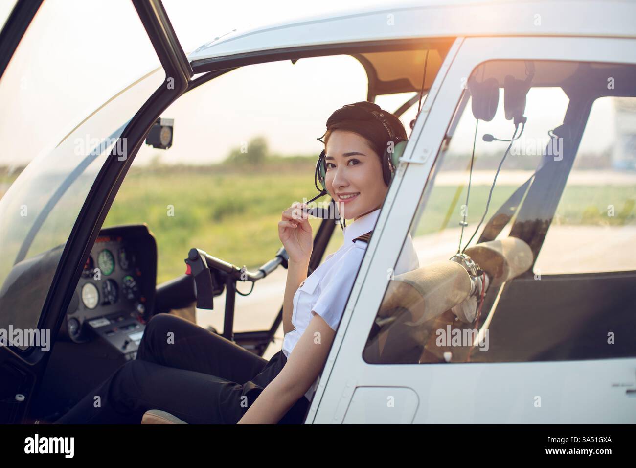 Female pilot smiling in cockpit hi-res stock photography and images - Alamy