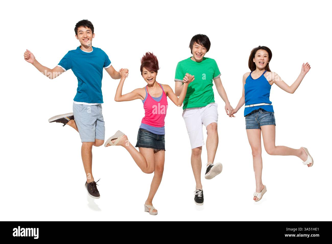 Stylish young Chinese jumping in mid-air Stock Photo - Alamy
