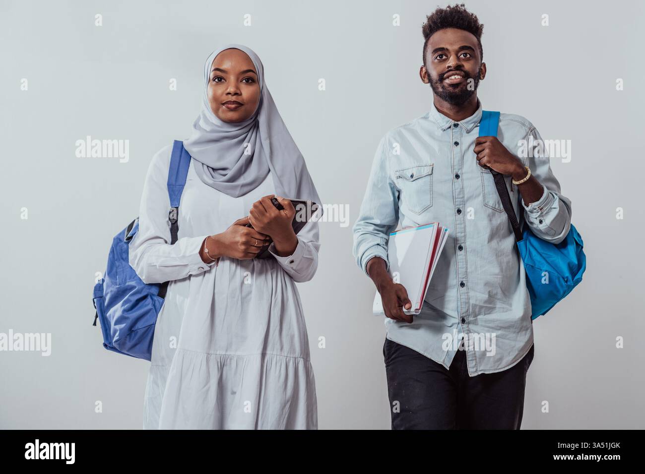 Young African students couple walking woman wearing traditional Sudan ...