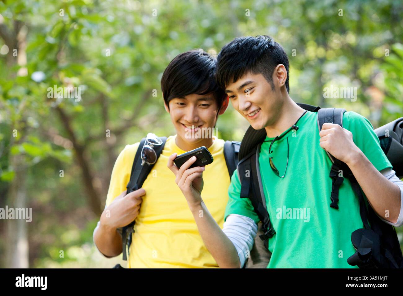 Chinese hikers using mobile phone with GPS Stock Photo - Alamy