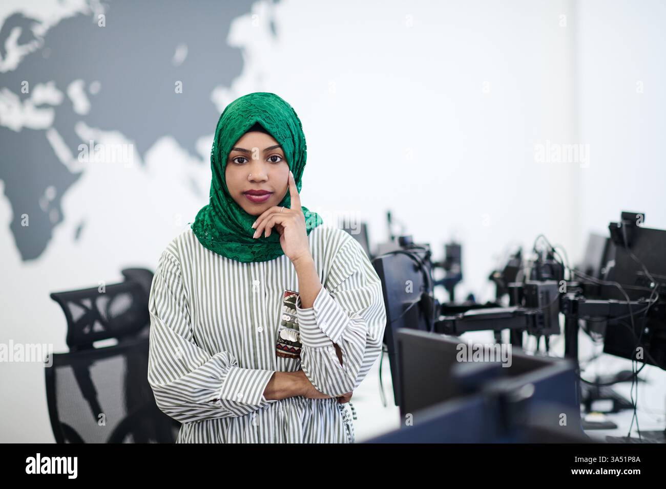 Portrait of muslim african female software developer with green hijab ...