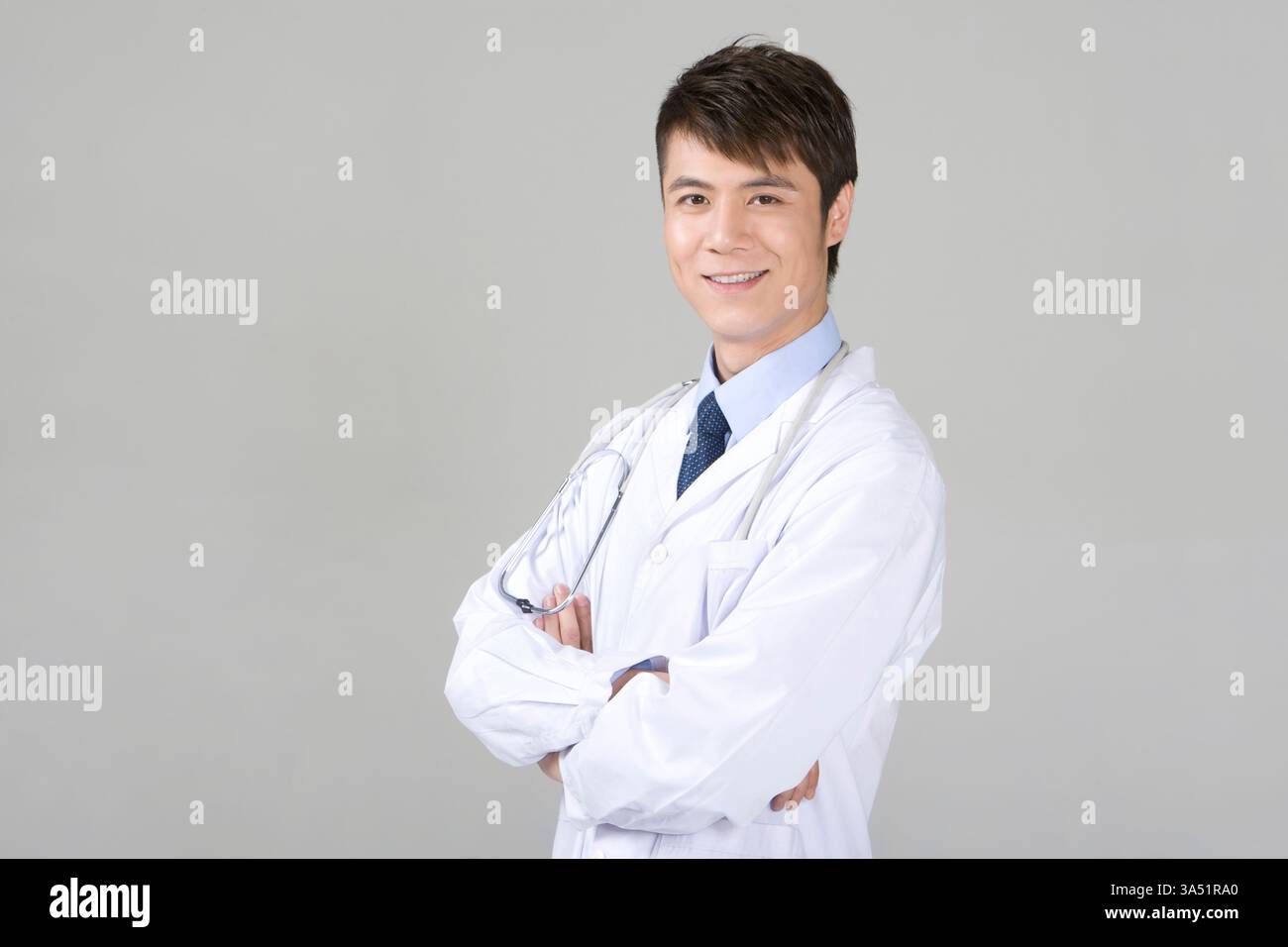 Confident young Chinese doctor in labcoat Stock Photo - Alamy
