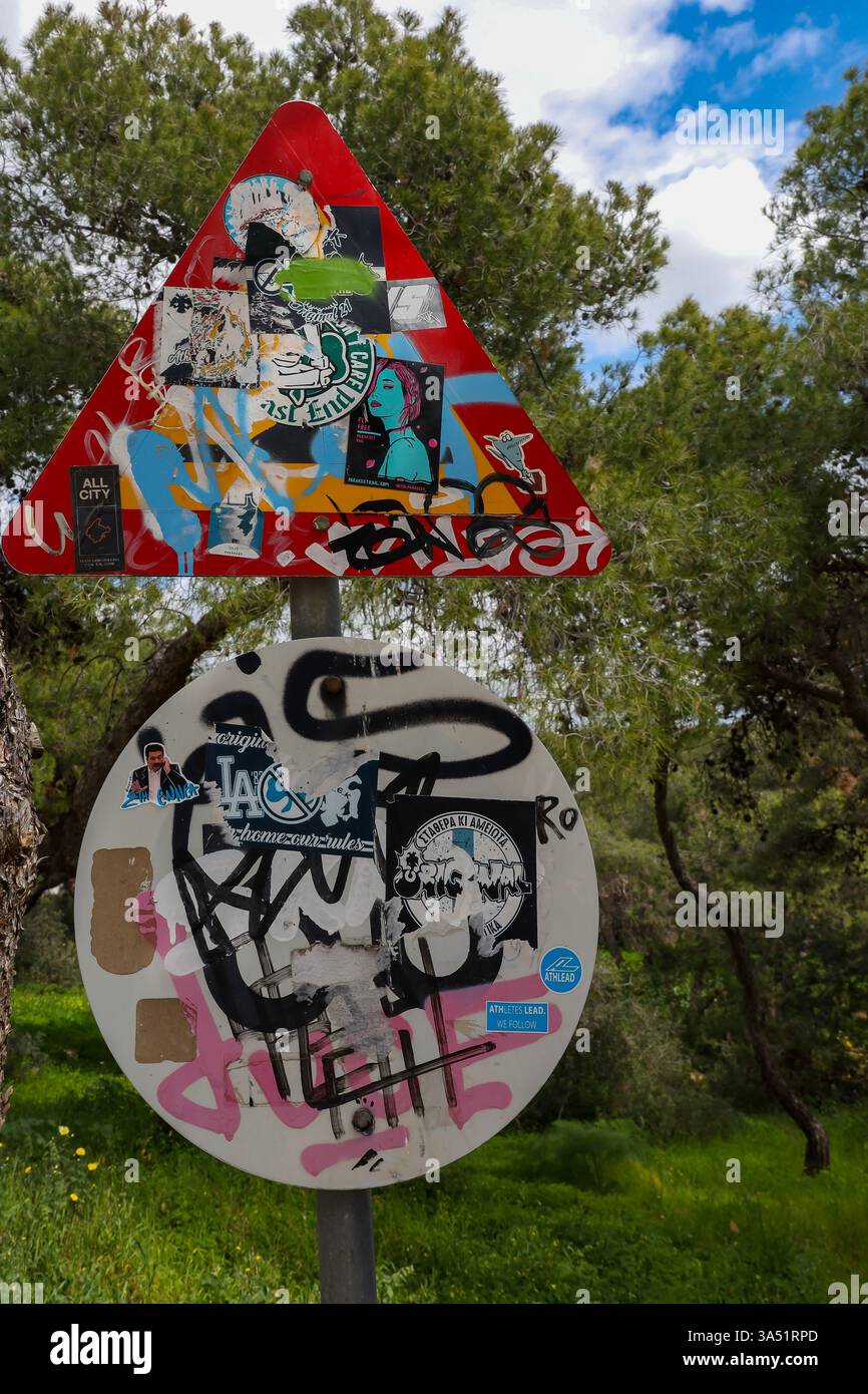 Two road signs, one triangular and one circular, are almost completely ...