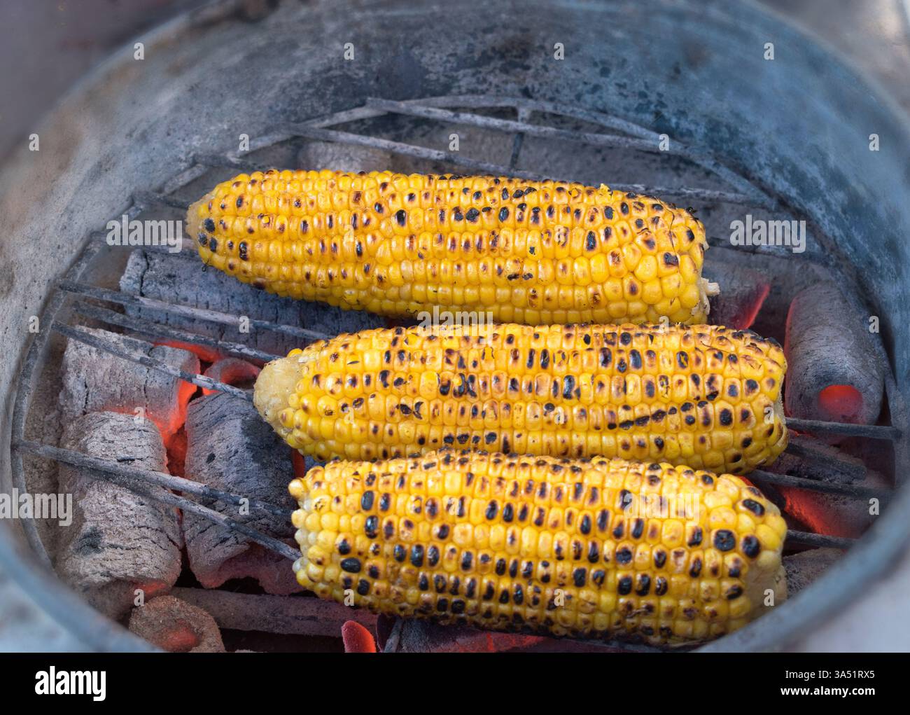Corn roasting on fire hi-res stock photography and images - Alamy