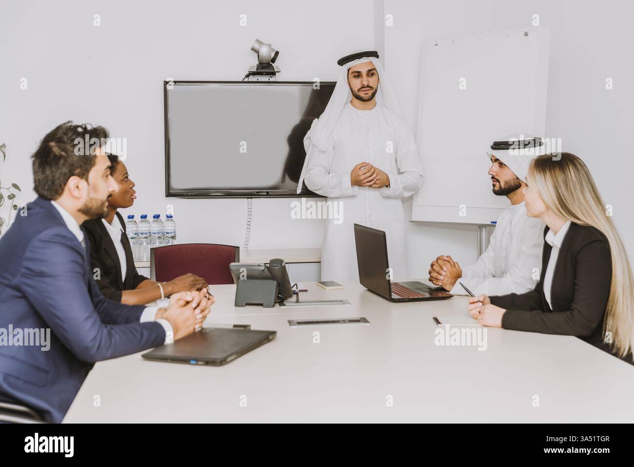 Multiracial group of business people having a meeting in an office in ...