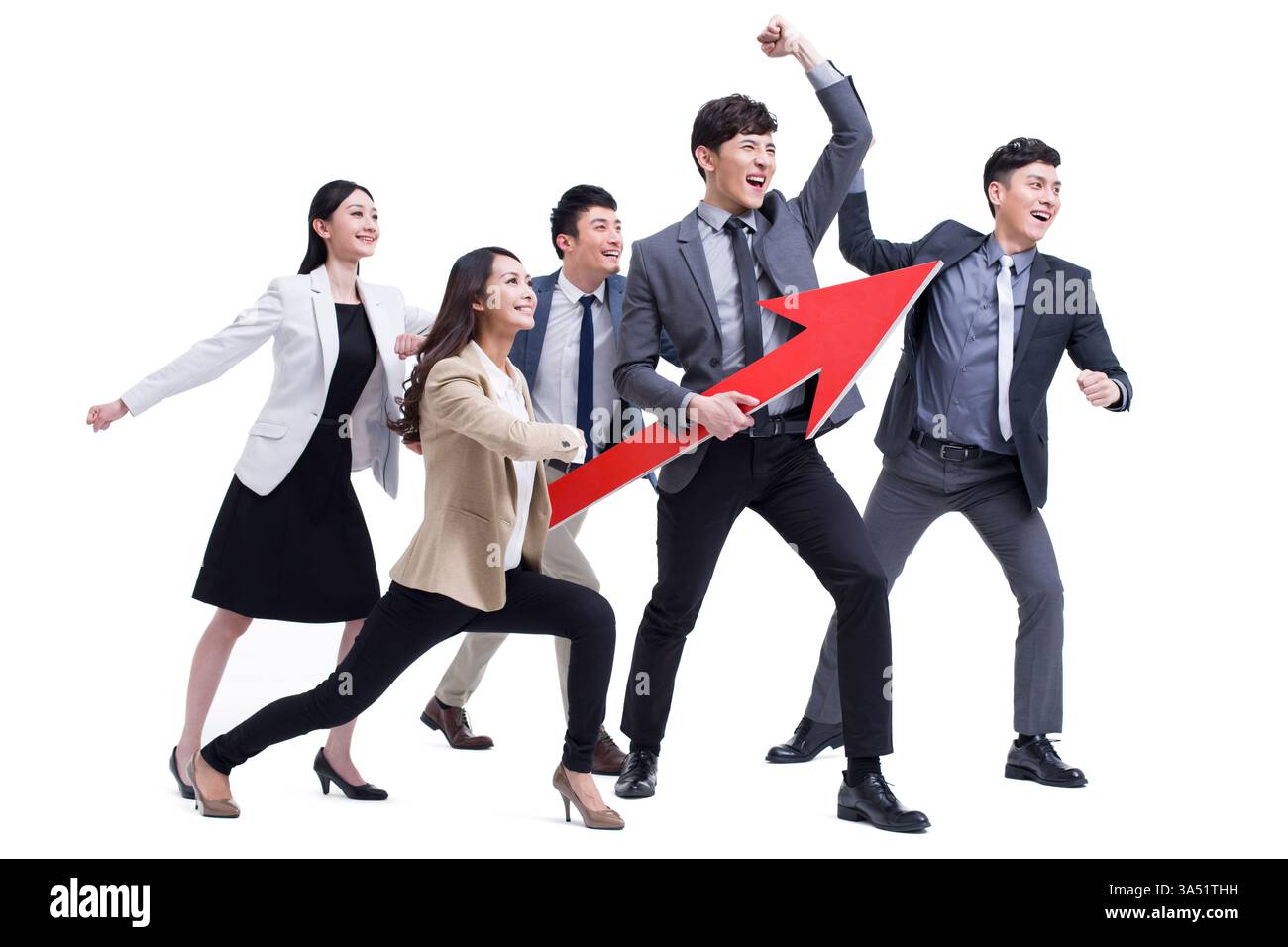 Chinese businessman raising closed fist holding red arrow with ...