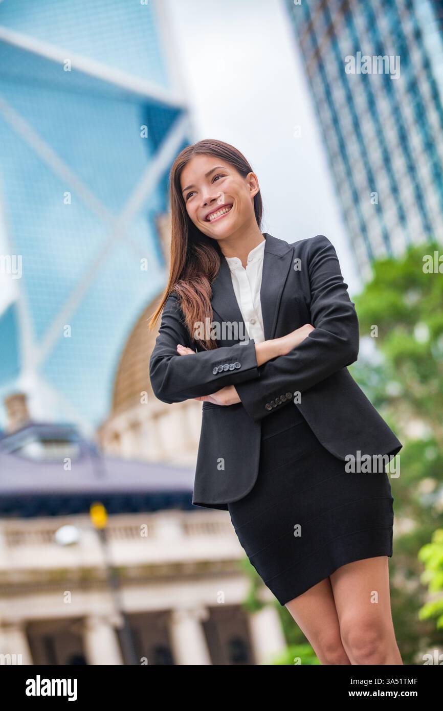 Asian woman standing proud and successful in suit cross-armed Stock ...