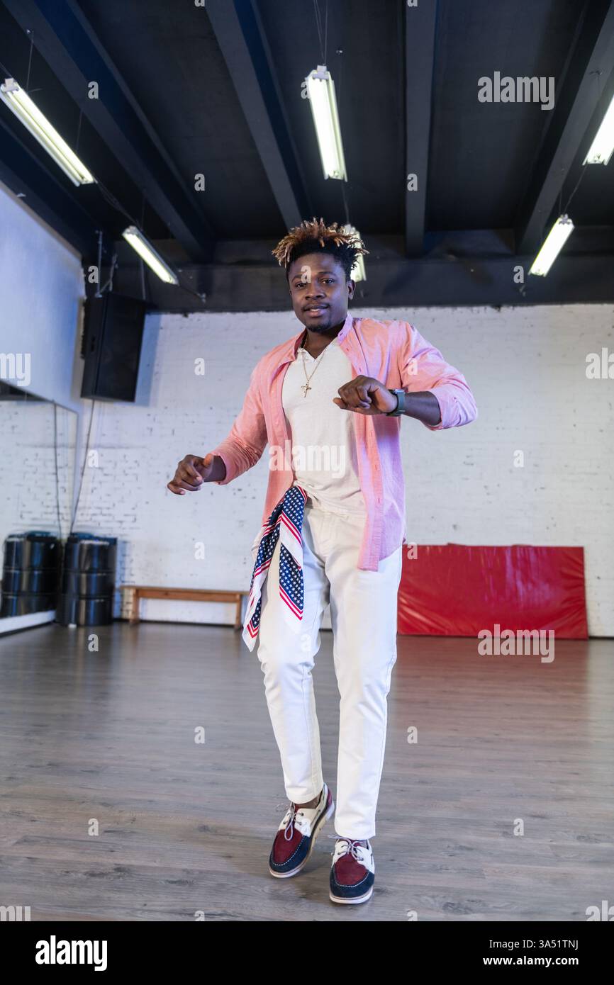 Smiling Black male dancing in dance studio Stock Photo - Alamy