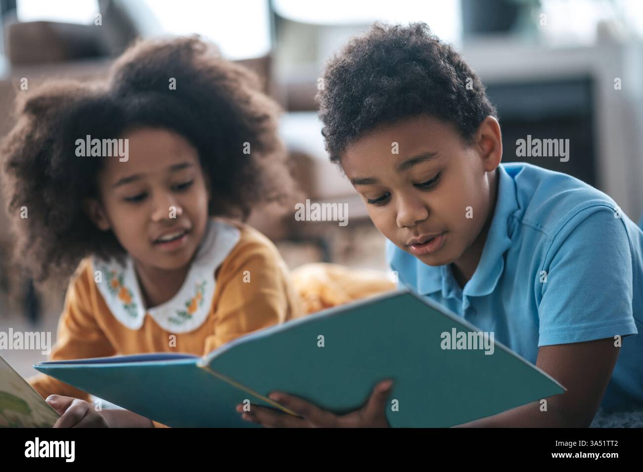 Two kids playing on floor hi-res stock photography and images - Alamy