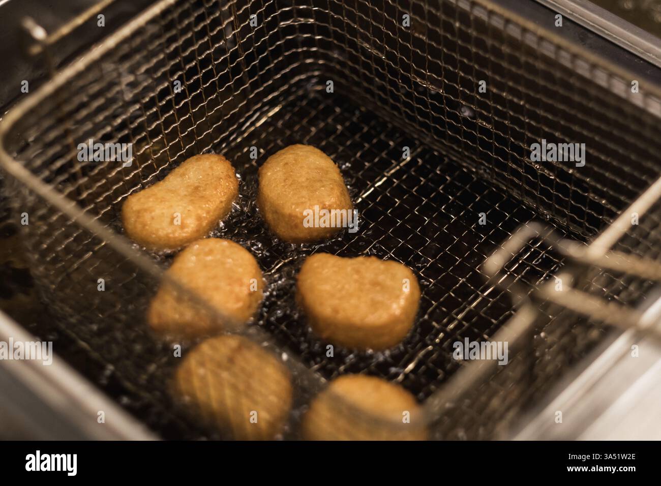 Process cooking chicken nuggets in hi-res stock photography and images ...