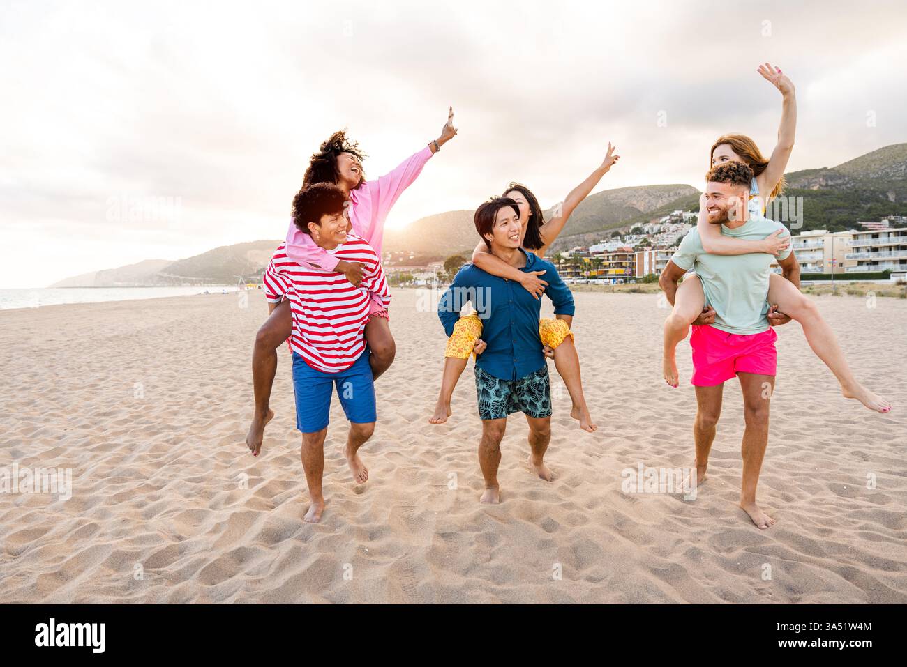 Group of young happy friends bonding outside, having fun on summertime ...
