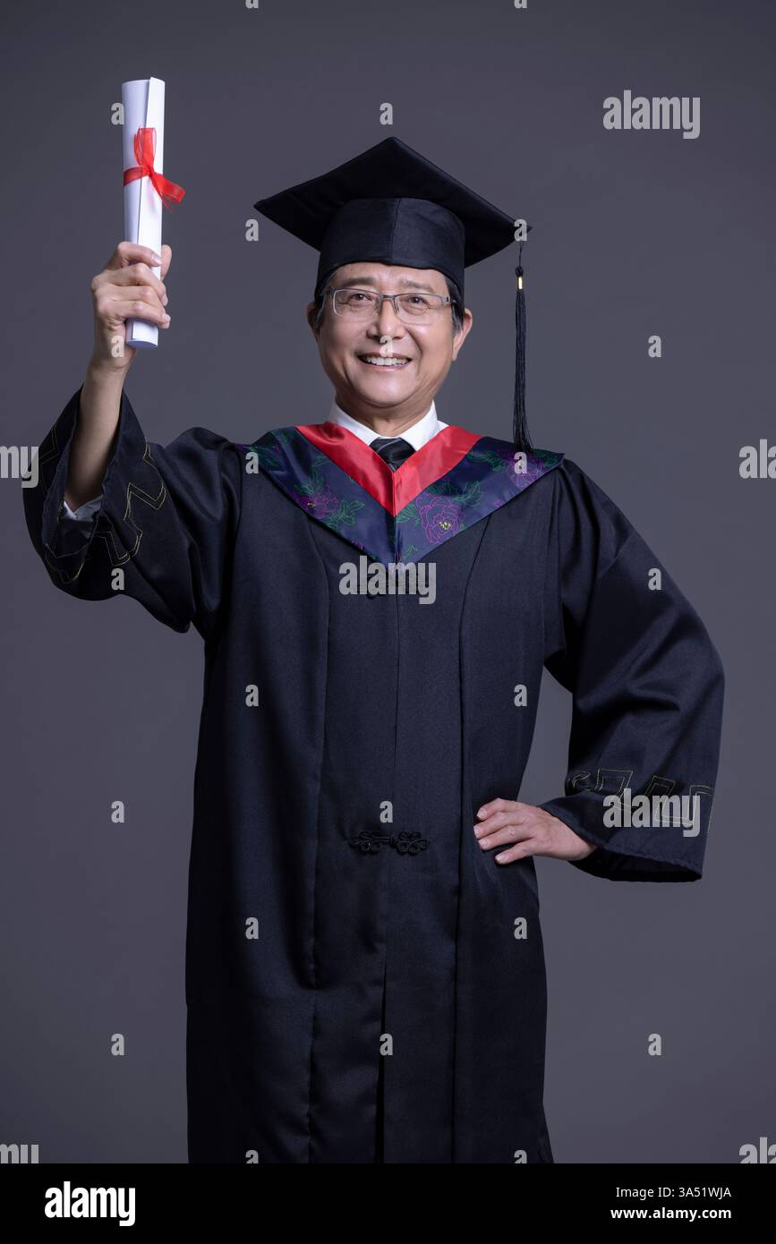 Senior Chinese student cheering for graduation Stock Photo - Alamy