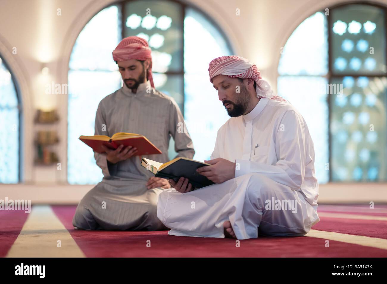 two muslim people in mosque reading quran together concept of islamic ...