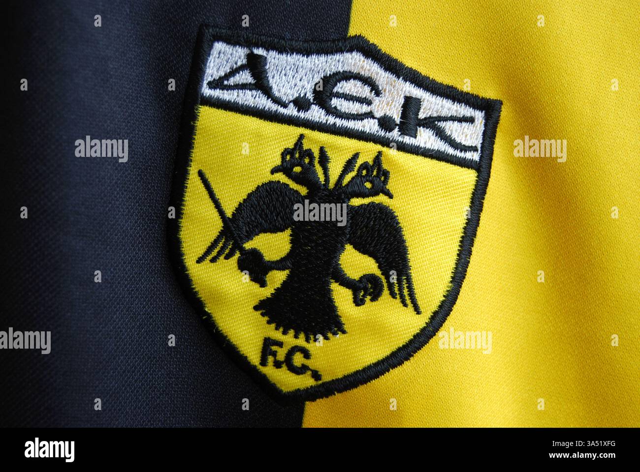 Close up photo of AEK Athens FC club badge on the home shirt Stock ...