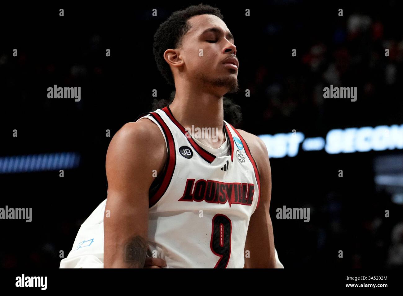 Louisville forward Khani Rooths (9) walks off the court after the first ...