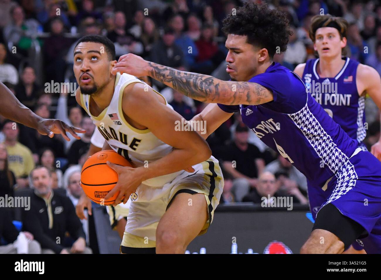 Purdue forward Trey Kaufman-Renn, left, drives to the basket against ...