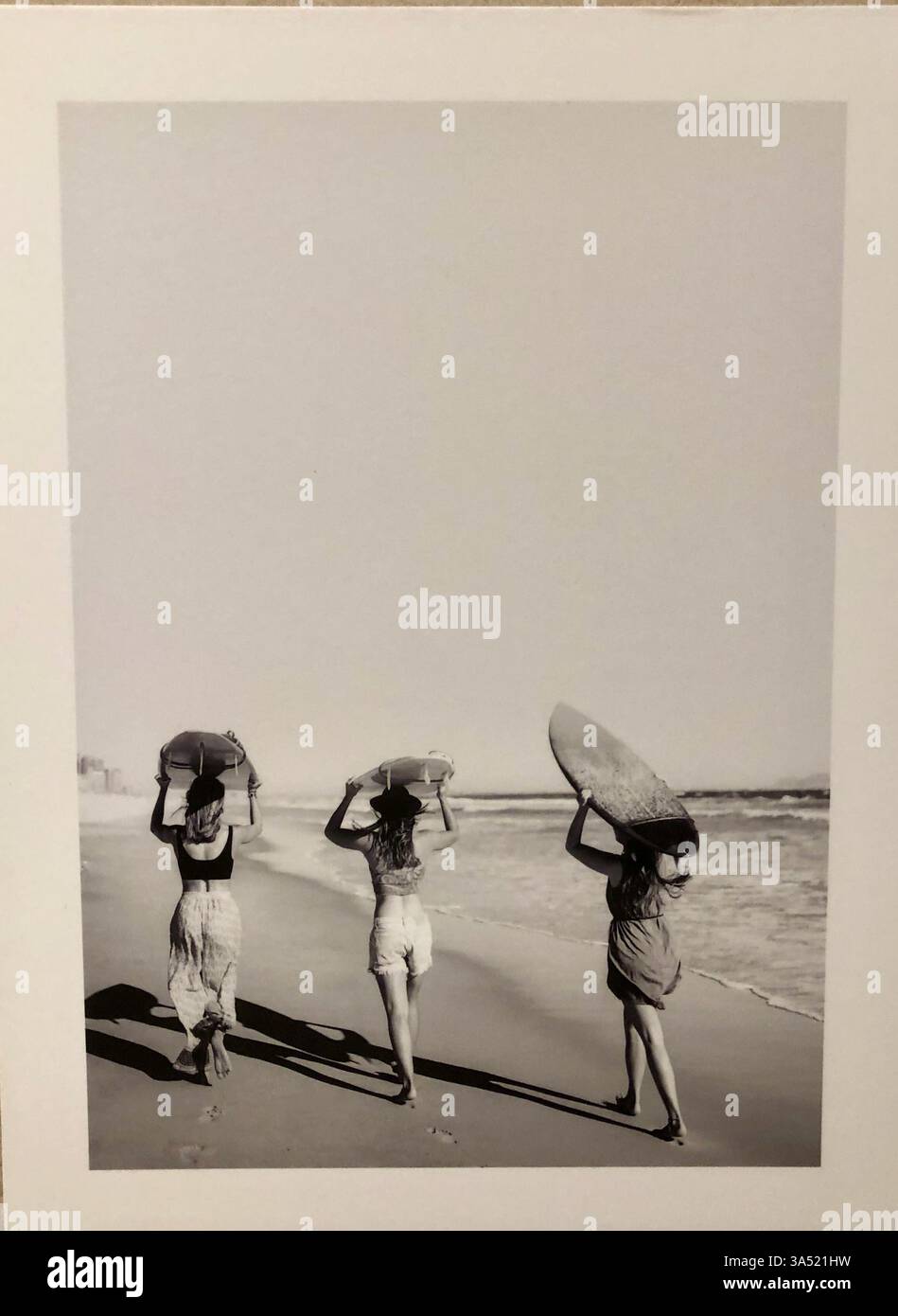 Three ladies on the beach Stock Photo - Alamy