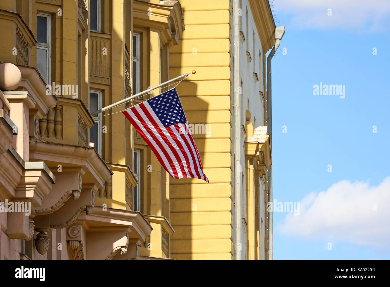 American flag on US embassy facade. Symbol of United State of America ...