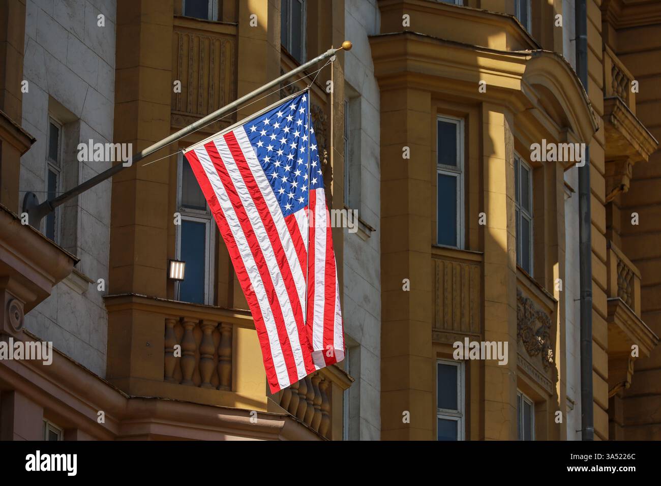 American flag on US embassy facade. Symbol of United State of America ...