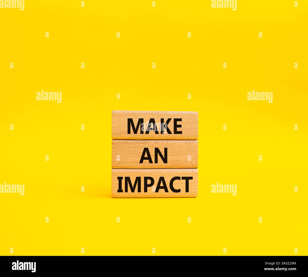 Make an impact symbol. Concept word Make an impact on wooden blocks ...