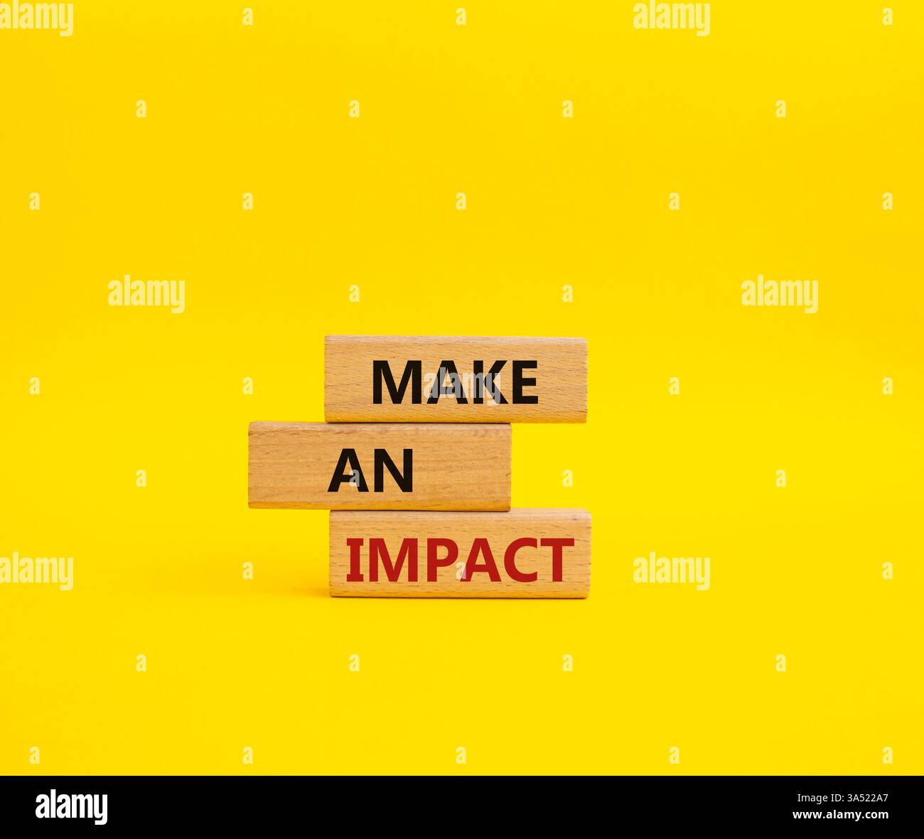 Make an impact symbol. Concept word Make an impact on wooden blocks ...