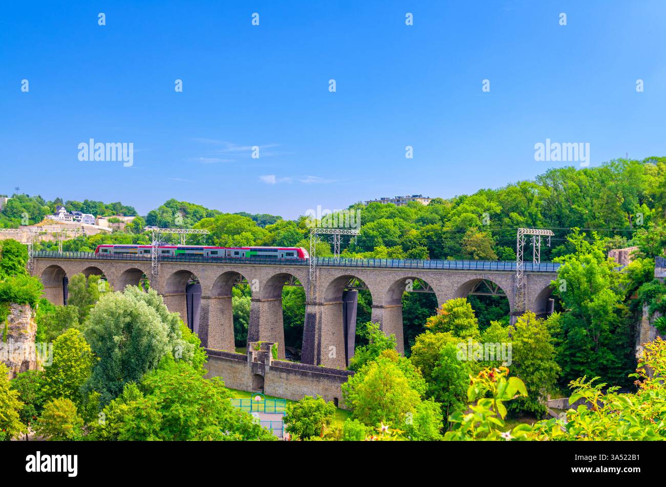 Train moving across urban landscape hi-res stock photography and images ...