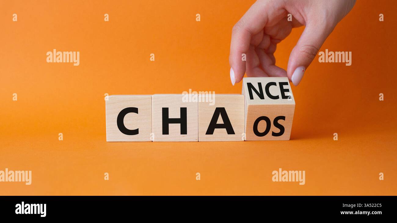 Chance vs Chaos symbol. Businessman hand Turnes cube and changes word ...