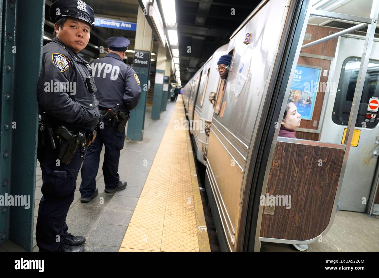 Police officers patrol in a subway station in New York, Thursday, March ...