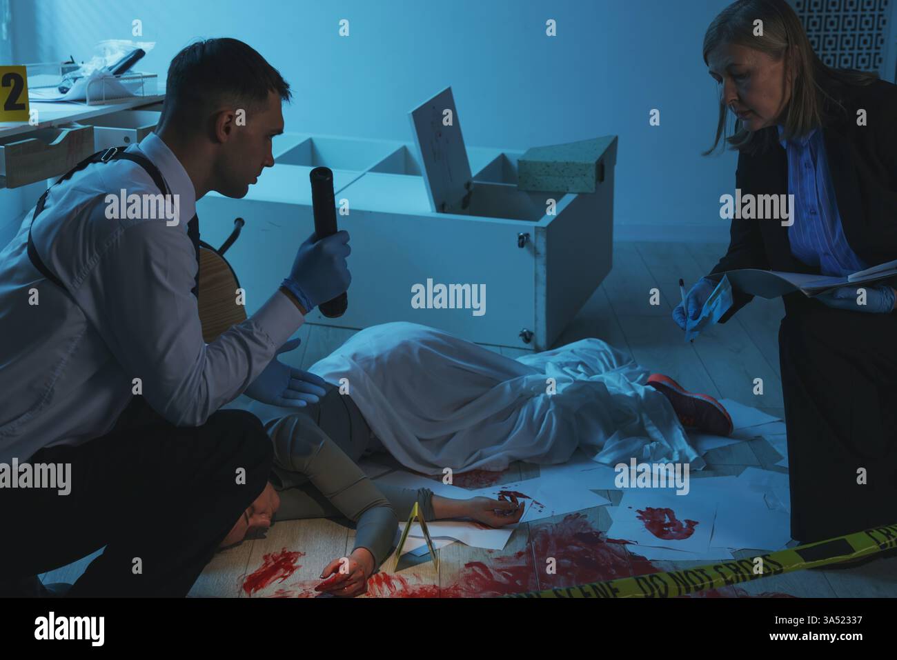 Forensic experts working at crime scene with dead woman's body indoors ...