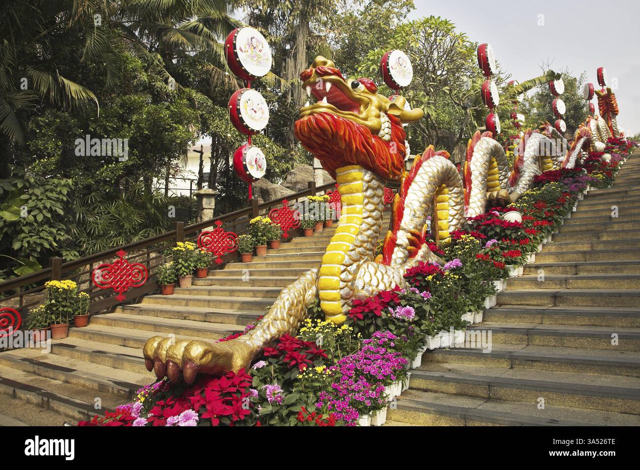 Traditionally decorated ladder in the Chinese park - a red dragon and ...