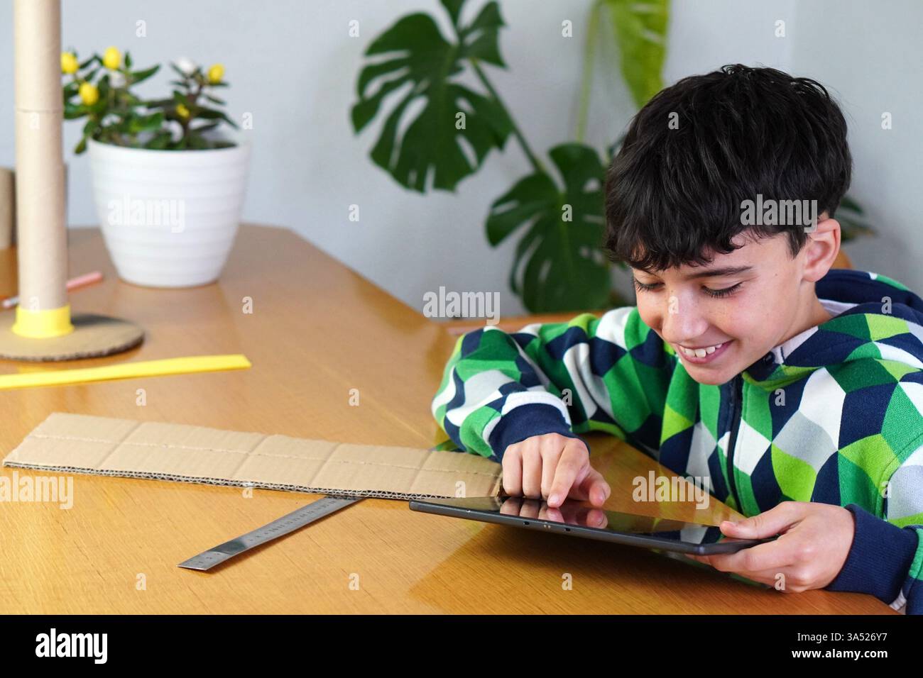 creativity and technology in children. child watching on the tablet a ...