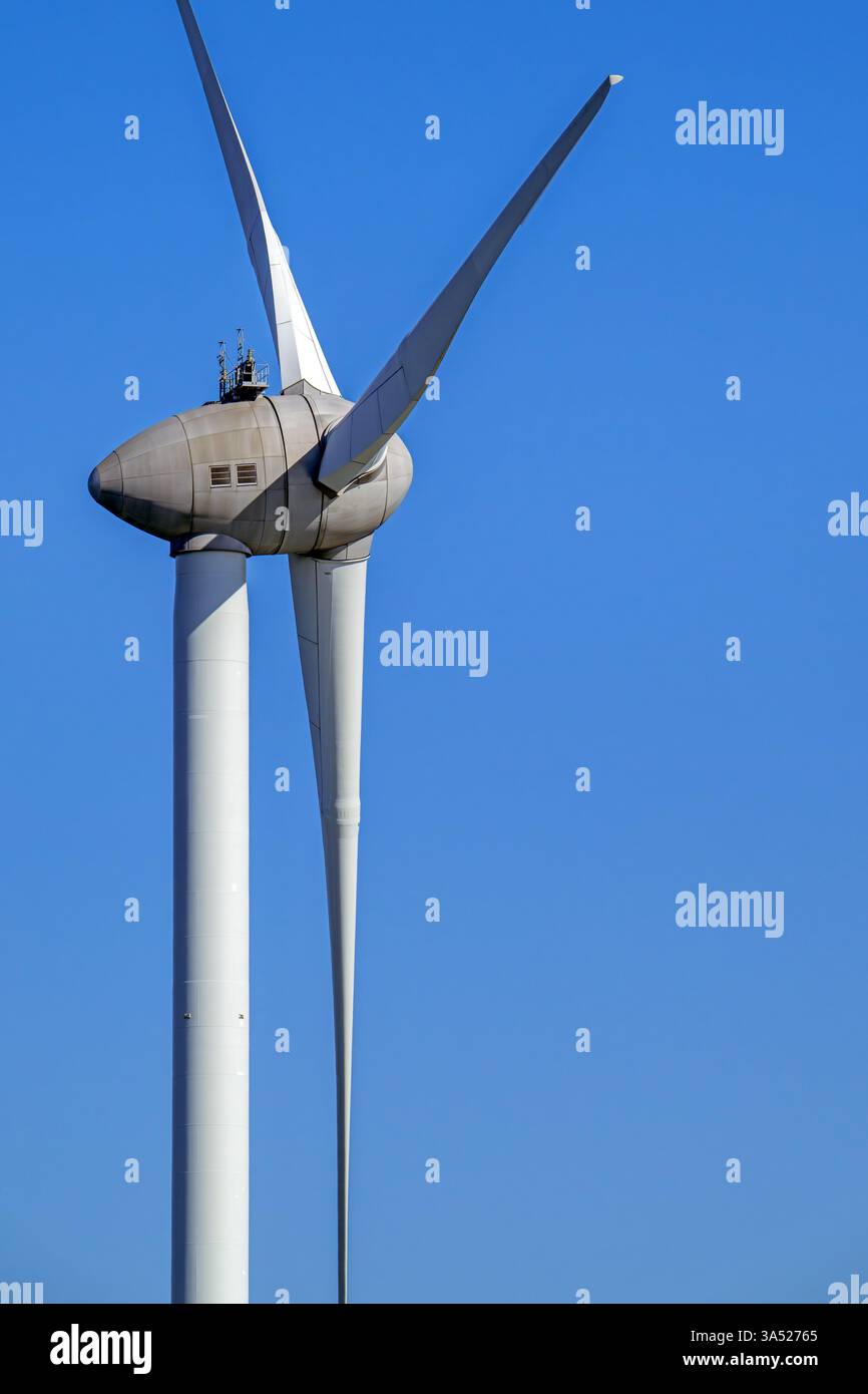 Wind turbine close-up showing tower, nacelle and huge rotor blades ...