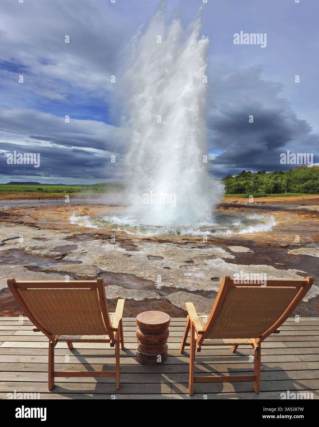 Geyser Strokkur in Iceland. Pillar of hot water and steam from forcing ...