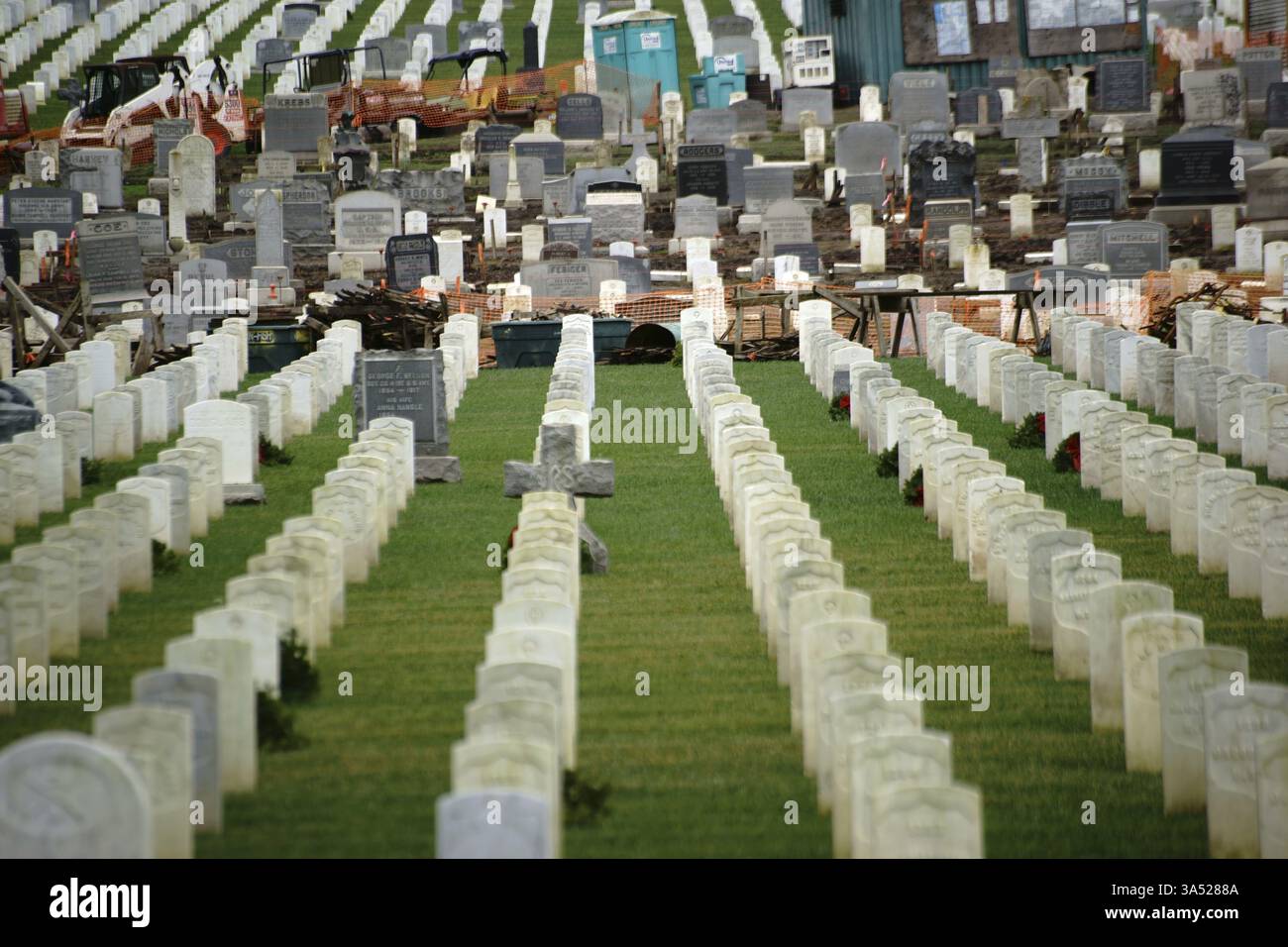 Tidying up graves hi-res stock photography and images - Alamy