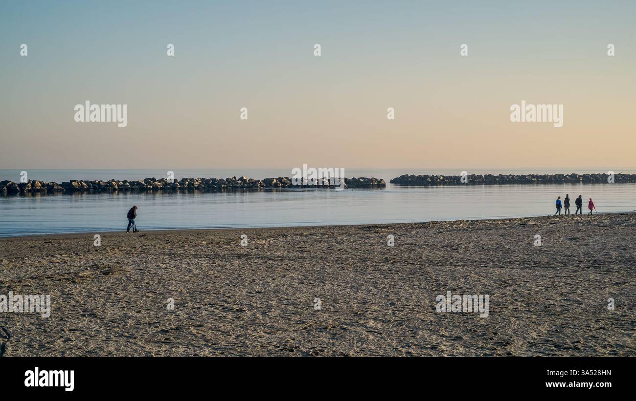 The beach of Marina di Ravenna in a late afternoon of winter with the ...