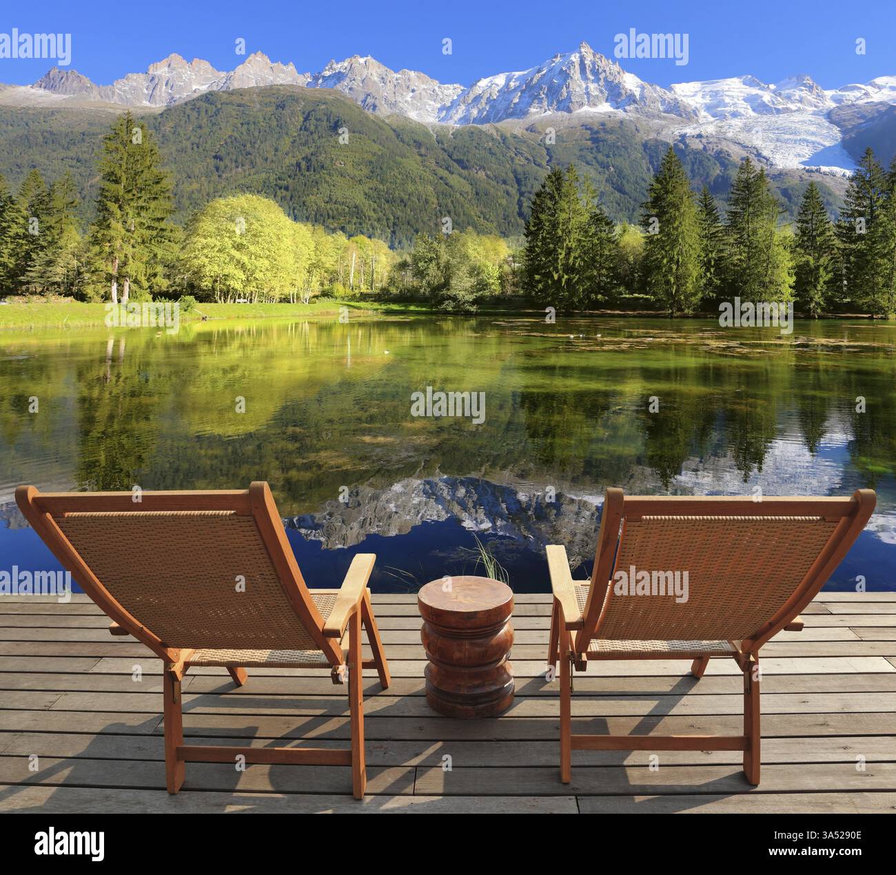 Comfortable lounge chairs on wooden platform for rest and observation ...