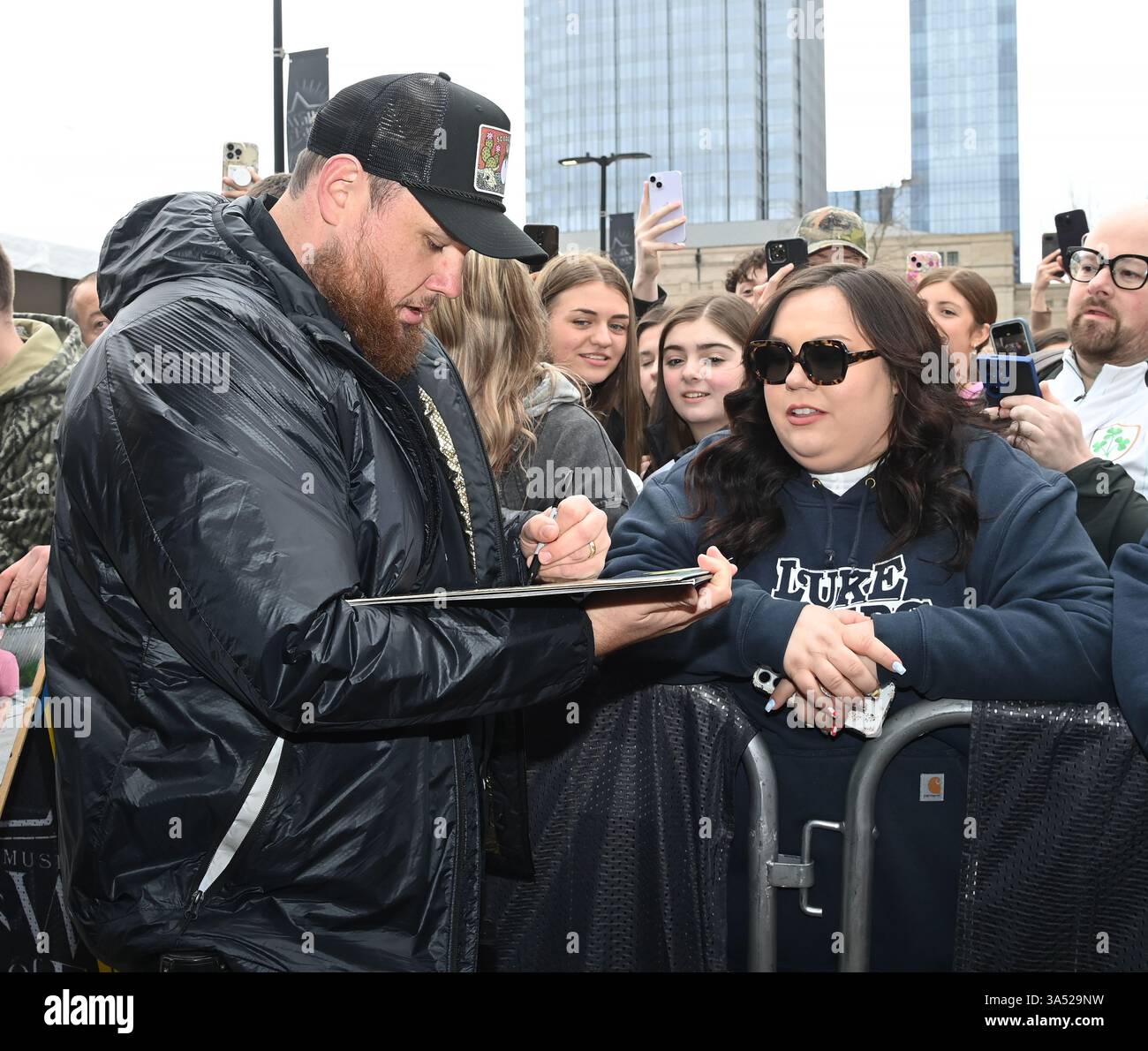 Nashville, USA. 20th Mar, 2025. Luke Combs signing autographs for fans ...