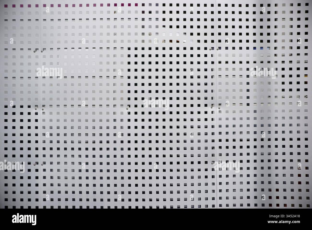 A metal grid with square holes for demarcation and privacy protection ...