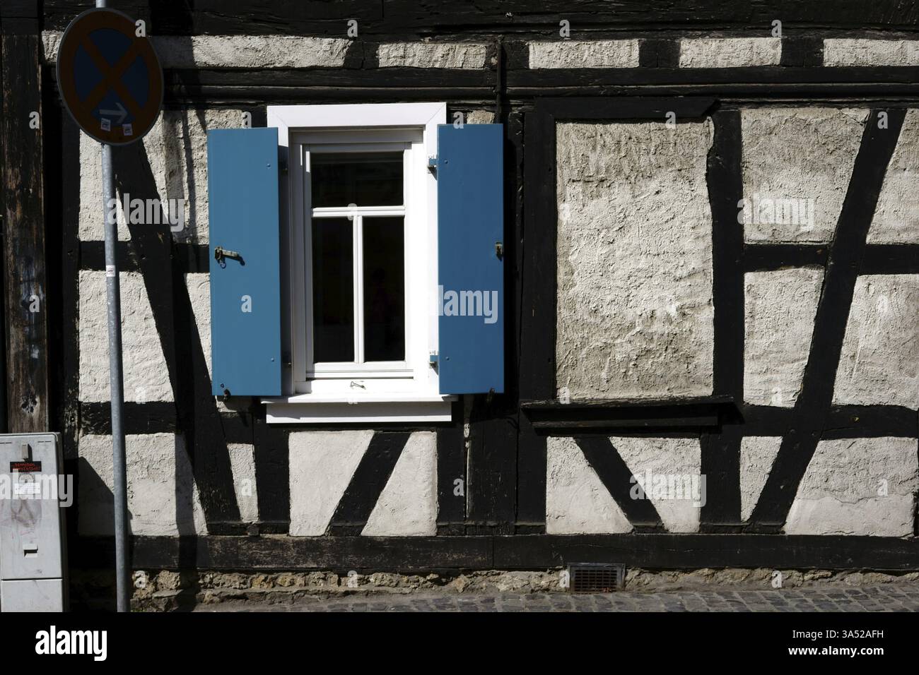 An old rickety half-timbered house with a striking beam construction ...