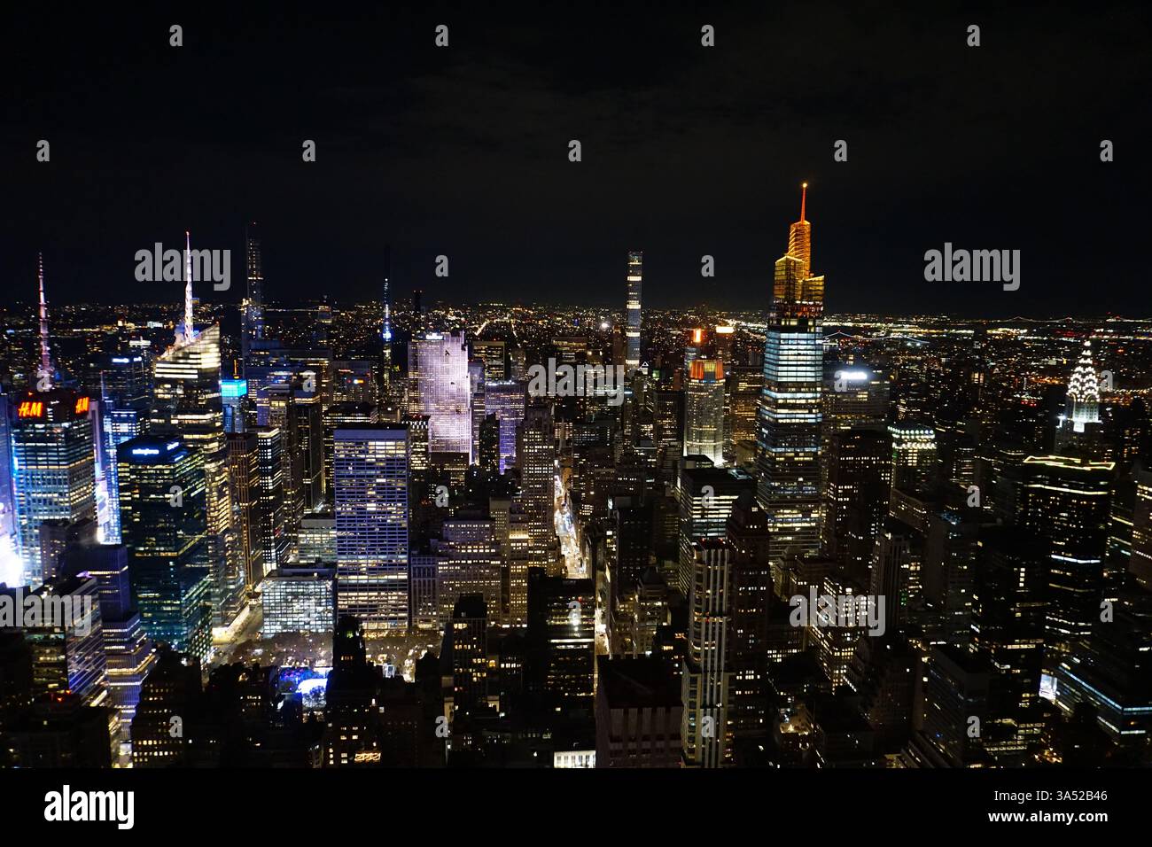 Aerial panorama with the city lights of the skyscraper office buildings ...