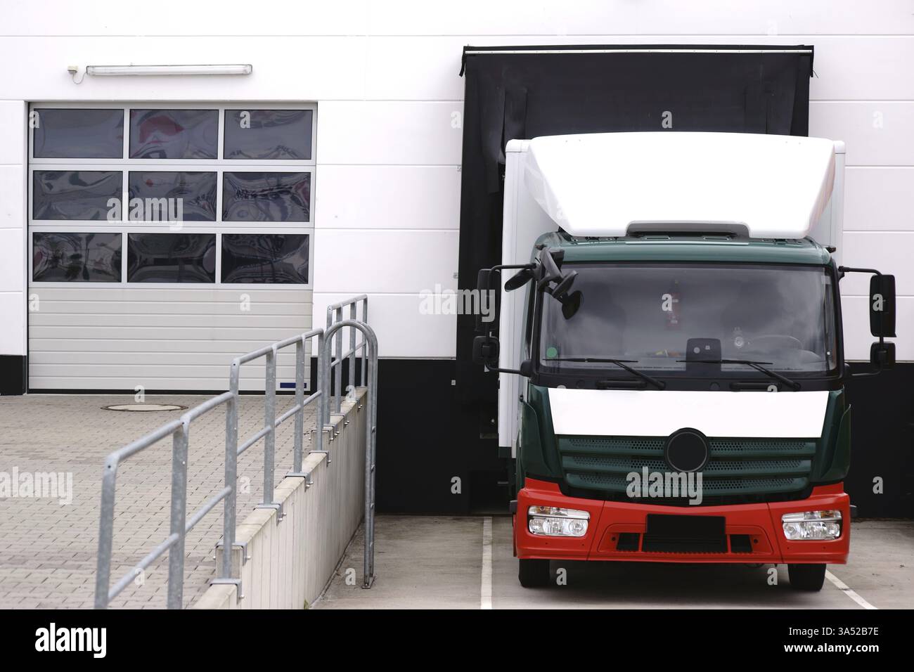 A lorry parks at the loading ramp to load goods and materials Stock ...