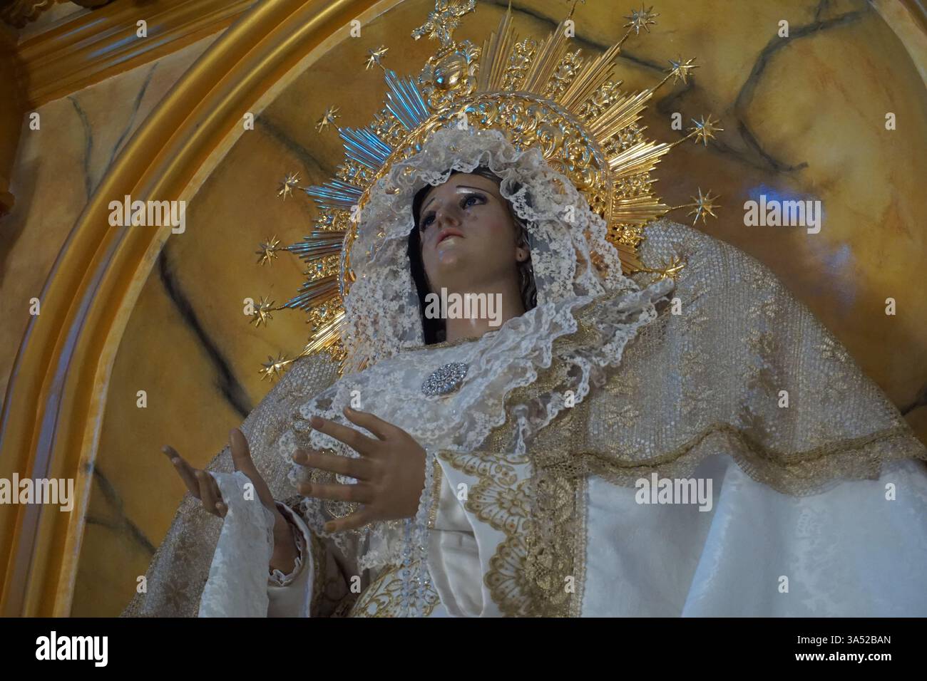 Close up from an upwards angle of a statue of Holy virgin mother Mary ...