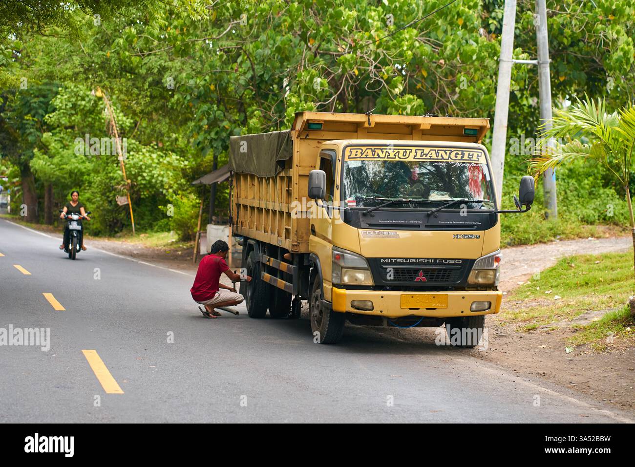 Asphalt roads and traffic with cars and motorcycles on the island of ...