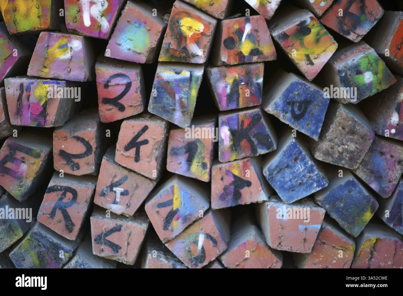 A pile of heaped up and crushed concrete rubble with colourfully ...