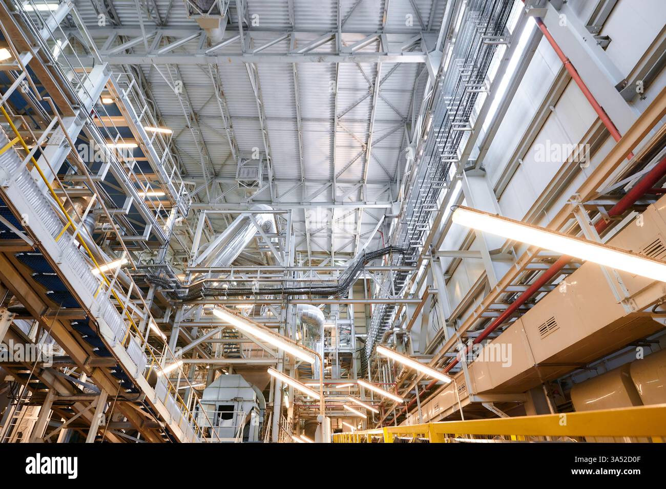 Inside a large chemical plant showcasing intricate pipelines and ...