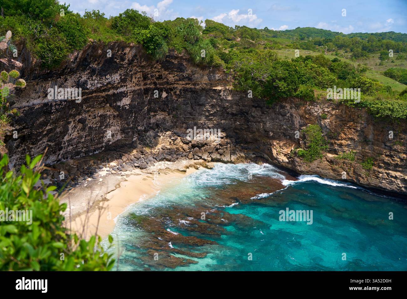 Cliff broken by wave of ocean formed perfect paradise untouched beach ...